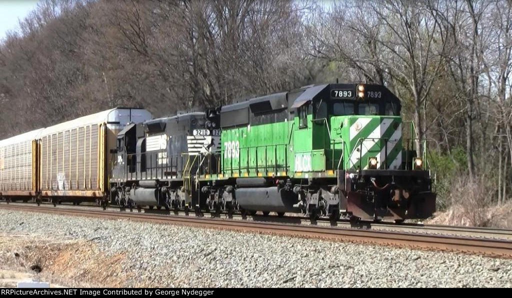 HLCX 7893 & NS 3210 (SD40-2"s) pulling a BMW autorack from the local factory